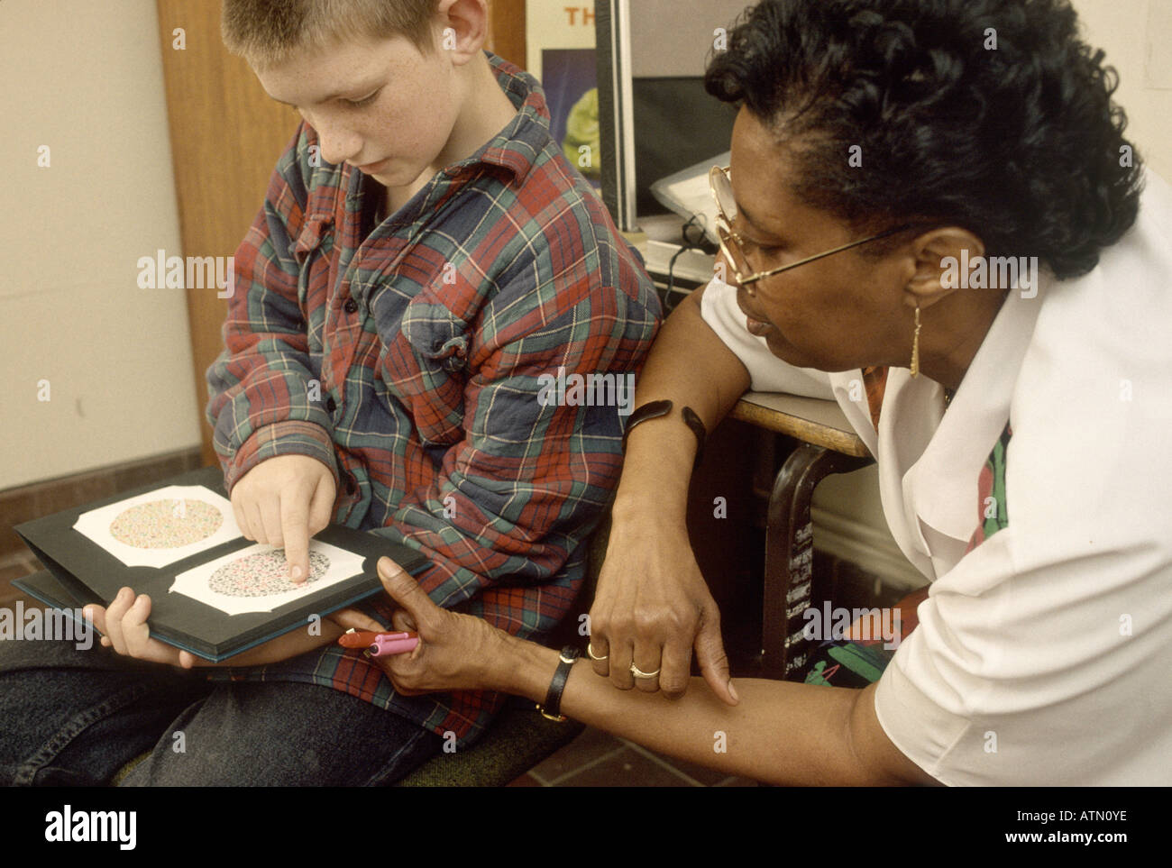 teenage boy taking a colour blind test Stock Photo - Alamy