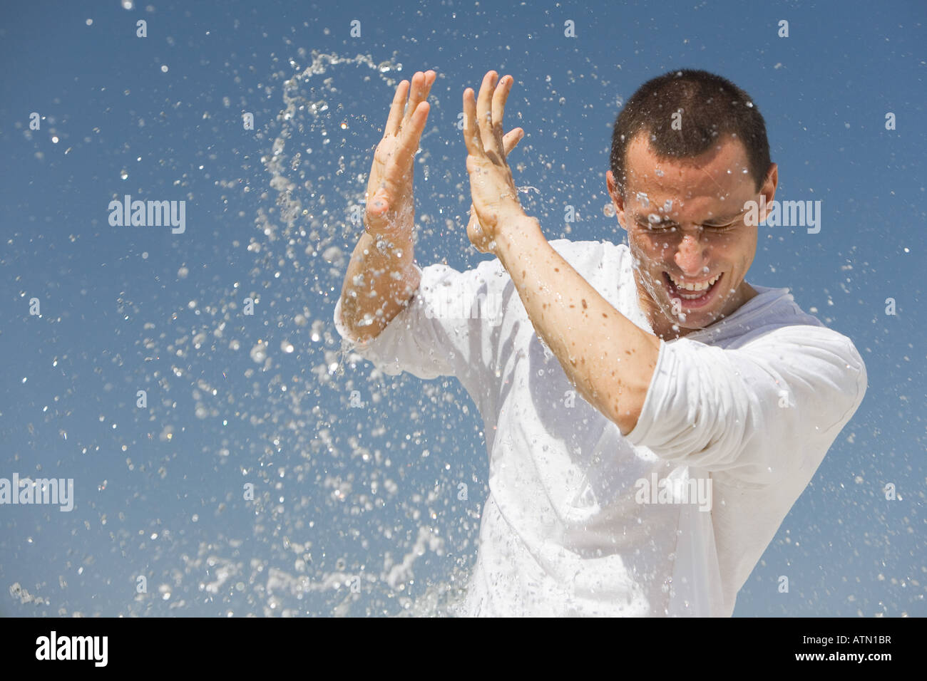 Man splashed water hi-res stock photography and images - Alamy