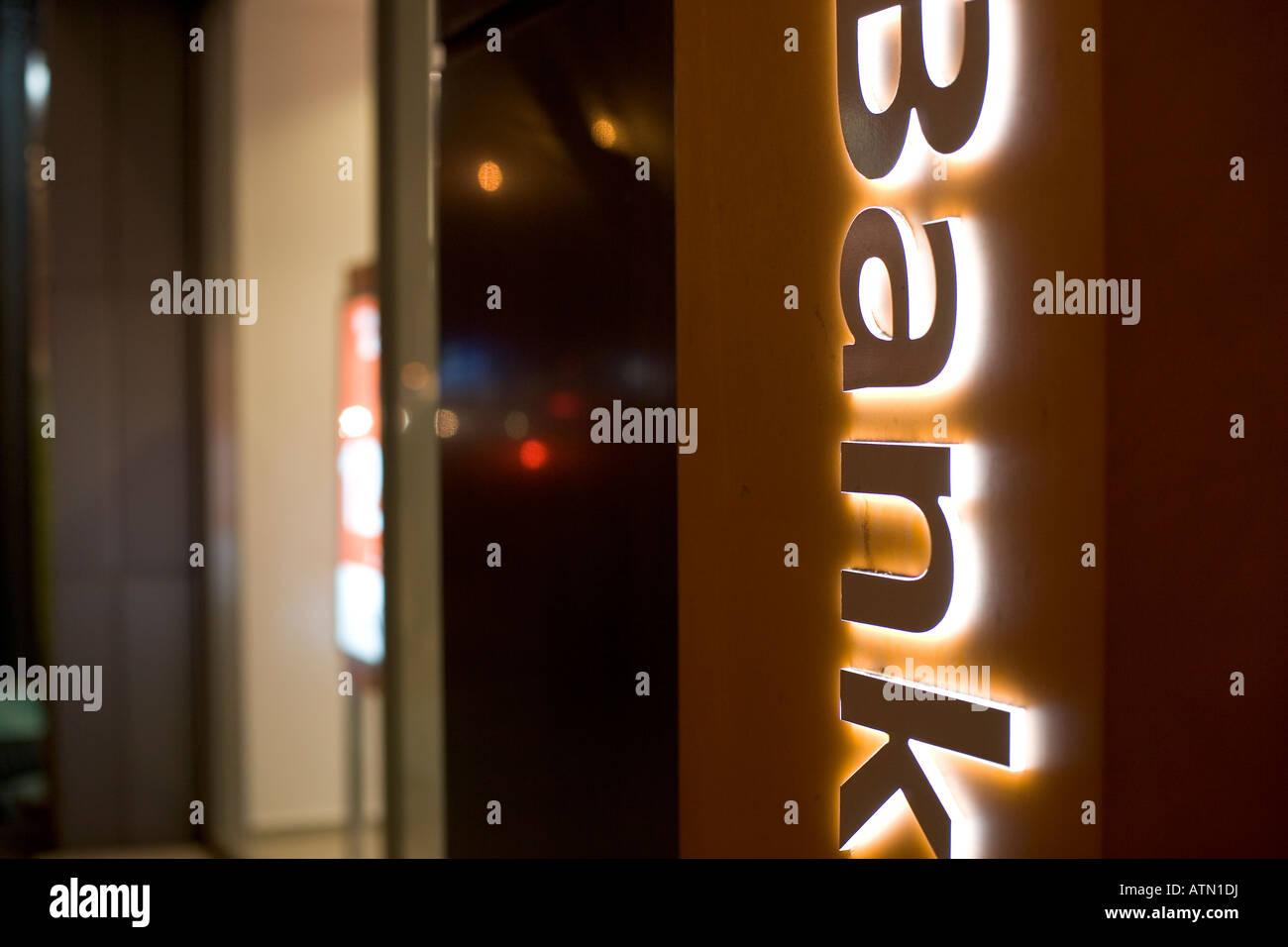 Light advertising sign of a bank situated upright Stock Photo - Alamy
