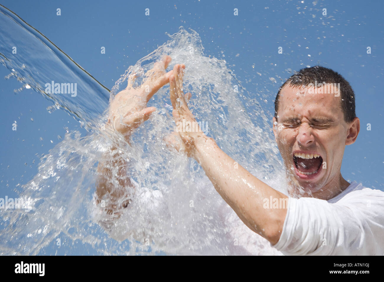 Man splashed water hi-res stock photography and images - Alamy
