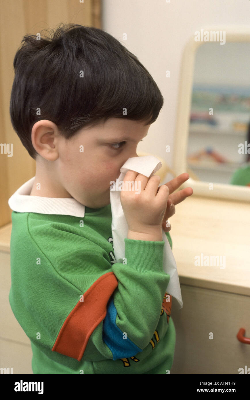 boy blowing his nose Stock Photo - Alamy