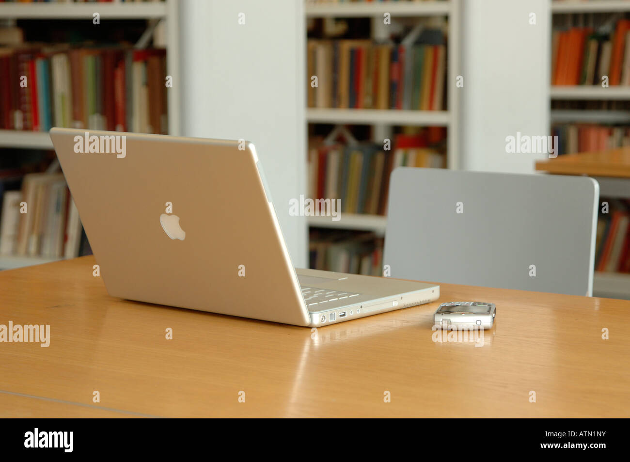 Library with laptop Stock Photo - Alamy