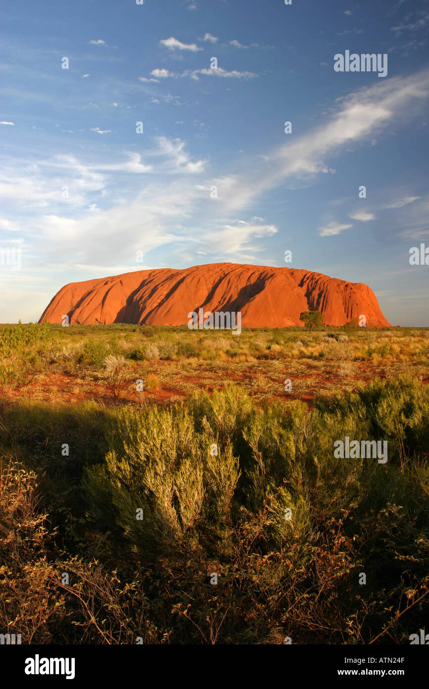 Iconic classic view of a glowing Ayers Rock Uluru red center Northern ...