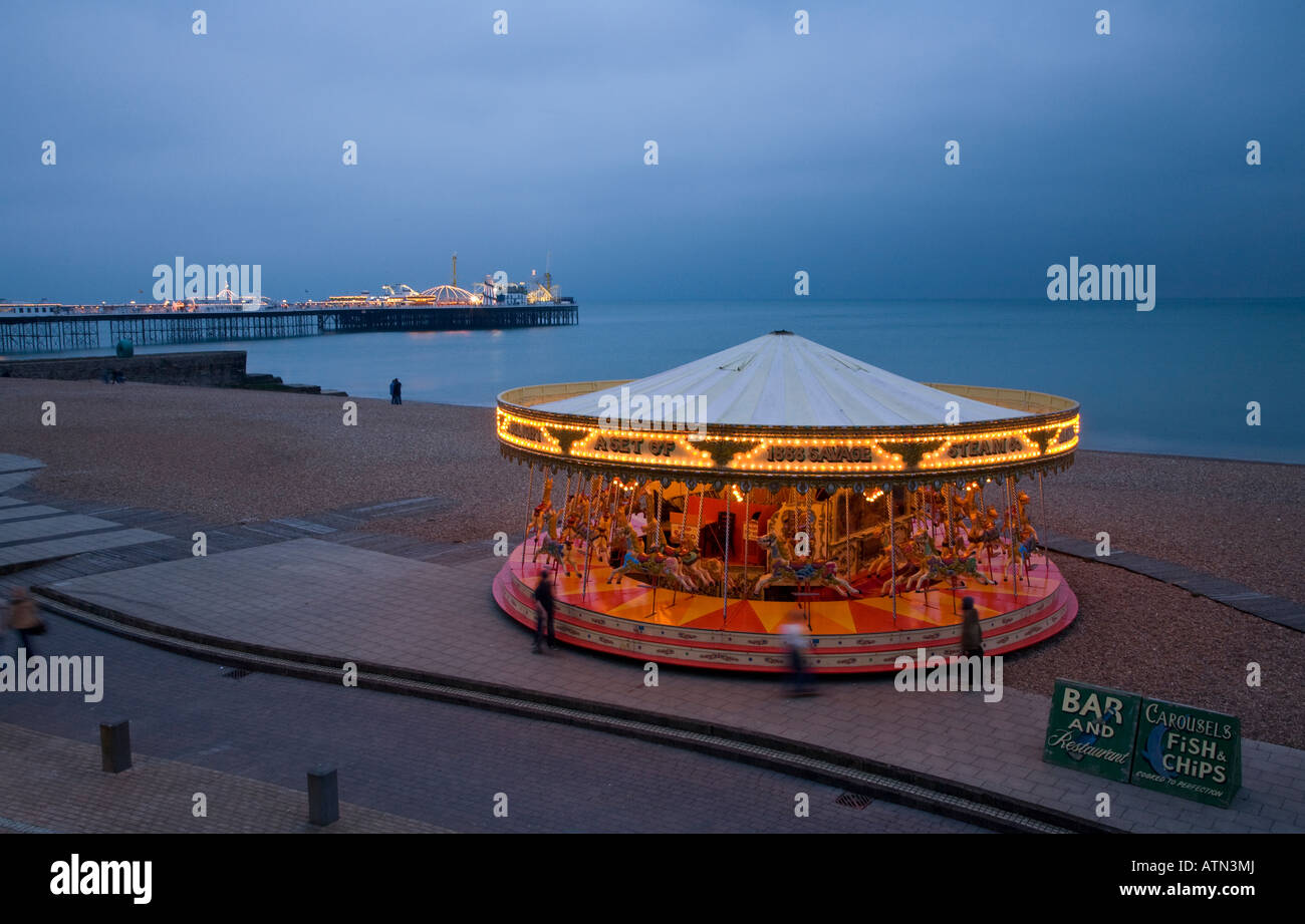Well lit carousel welcomes daytripper to the English coastal town of ...