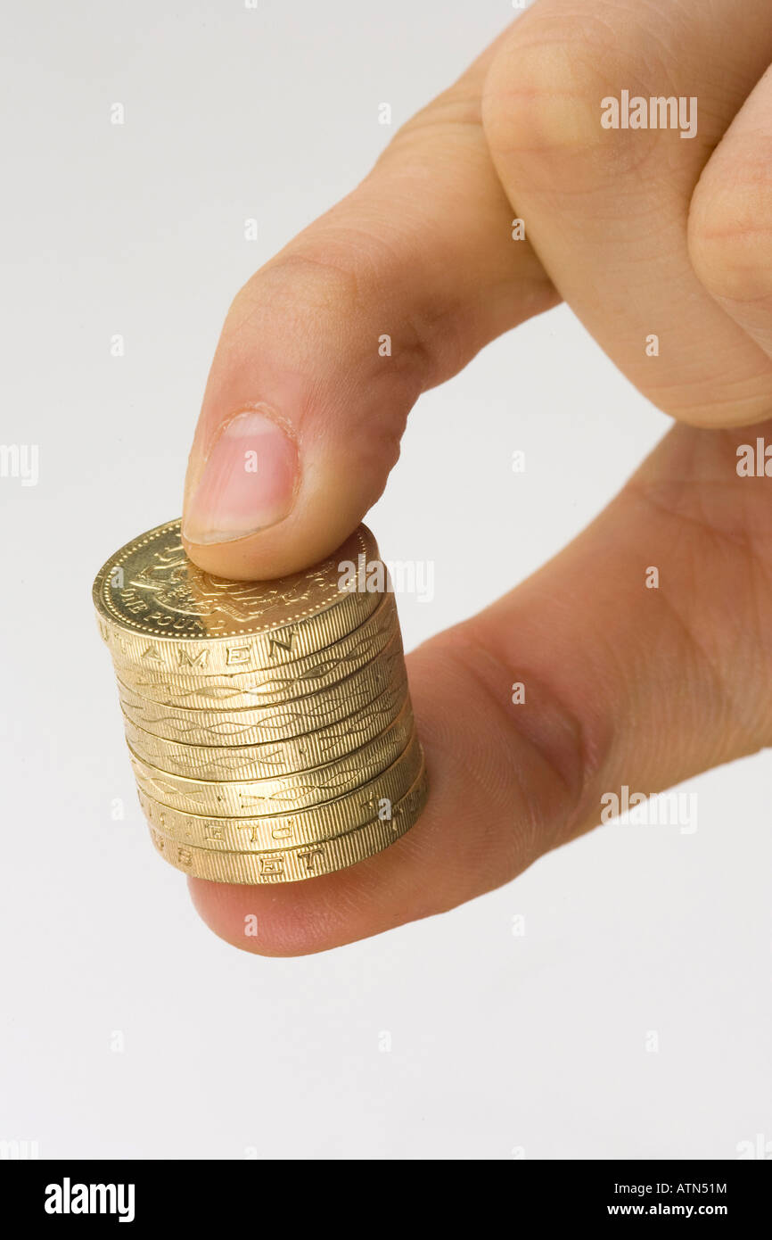 hand holding pound coins Stock Photo - Alamy