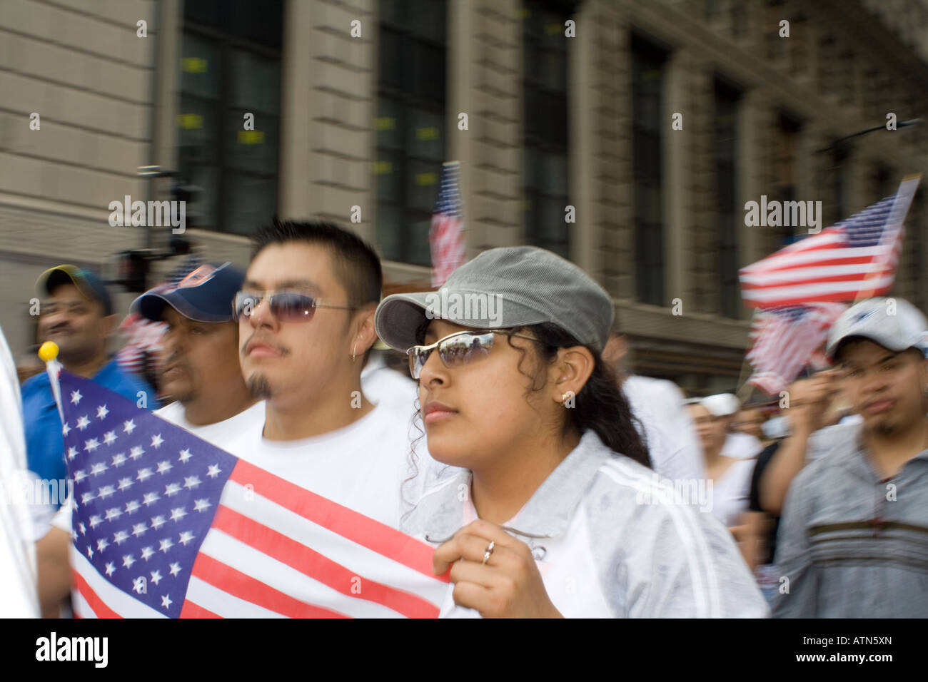 Hispanic workers marching in a protest Chicago Illinois carrying ...