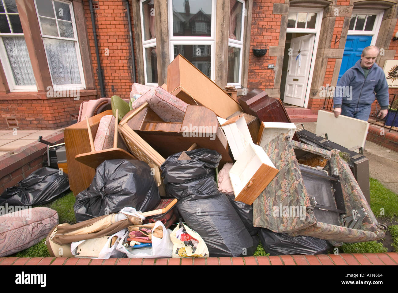 flood damaged property piled up outside flooded out houses in carlisle ...