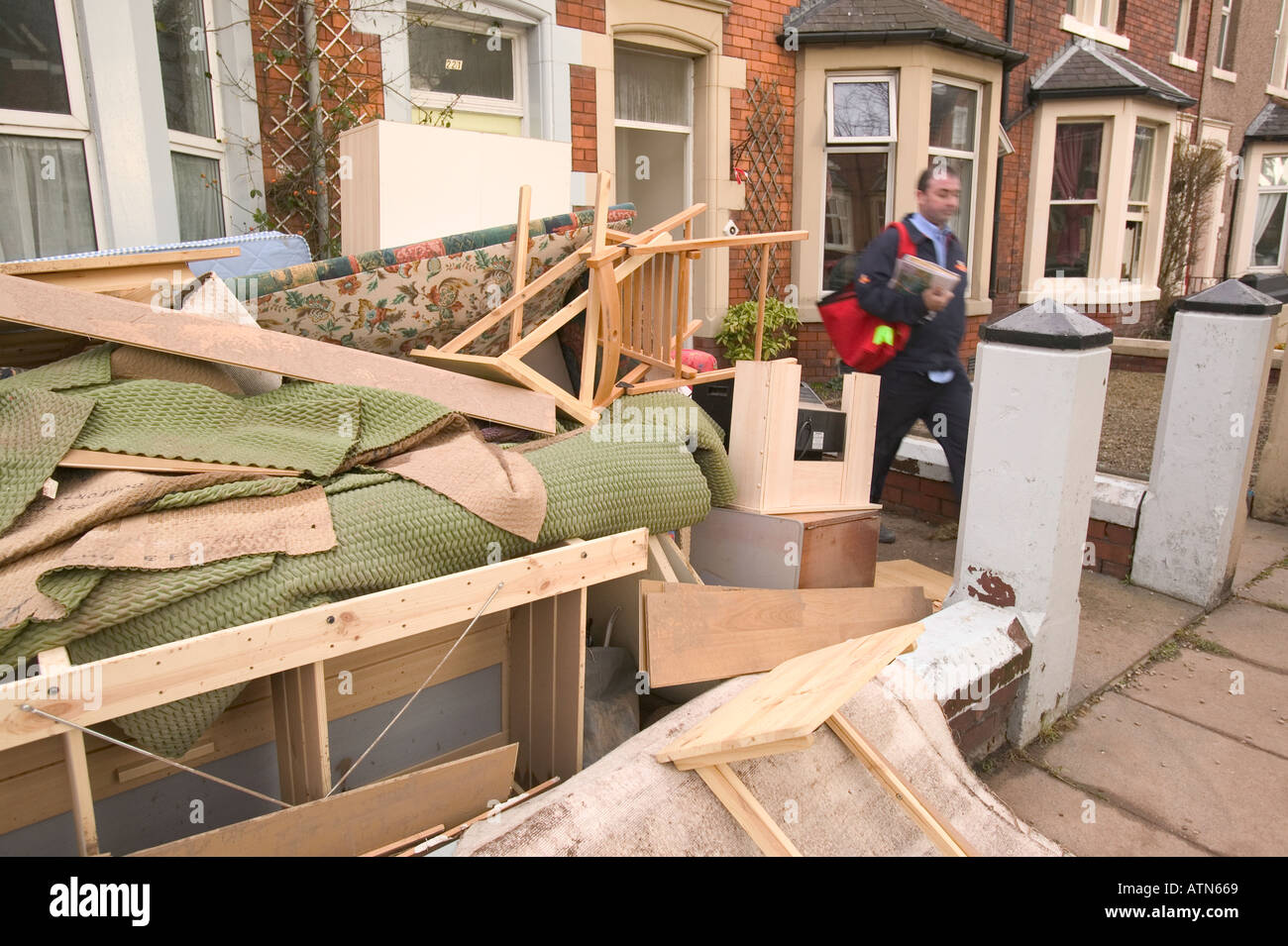 flood damaged property piled up outside flooded out houses in Carlisle ...
