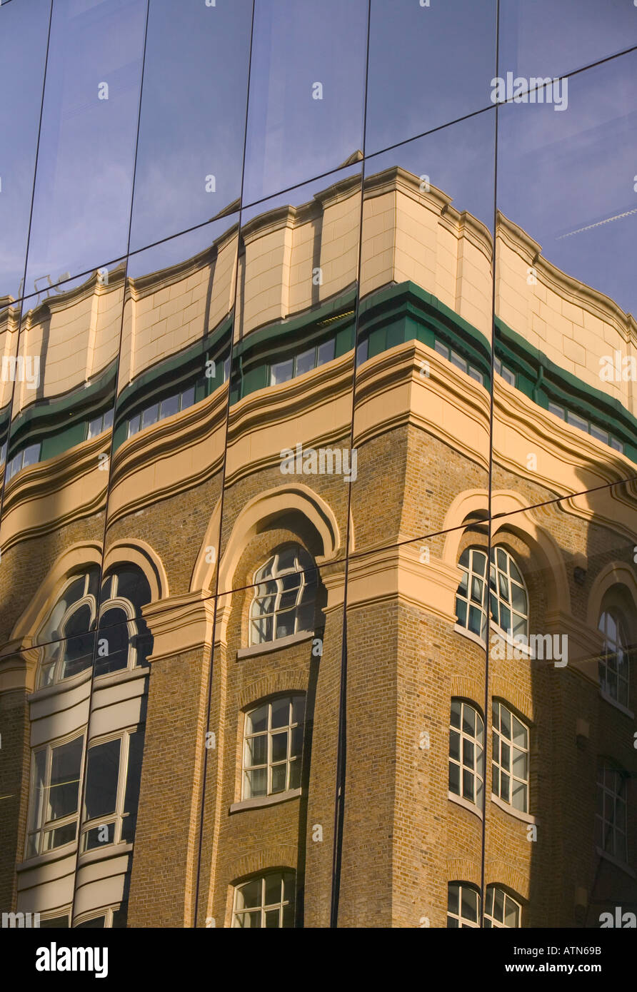 old building reflected in the glass of 6 more london place London Stock ...