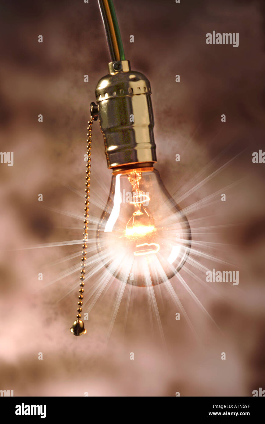 Bare clear light bulb in socket Stock Photo - Alamy