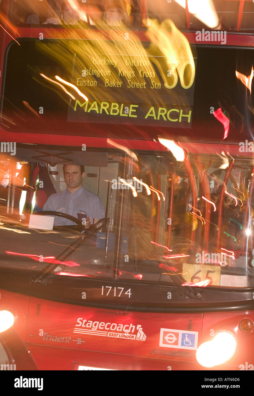 a london bus at night Stock Photo - Alamy
