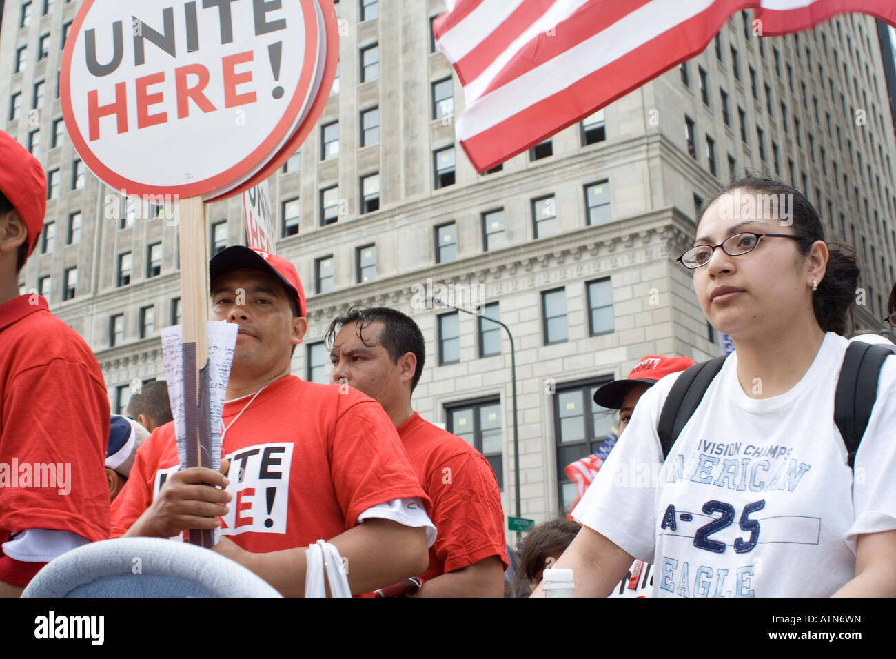 Hispanic immigration rally man carrying a sign saying unite here Stock ...