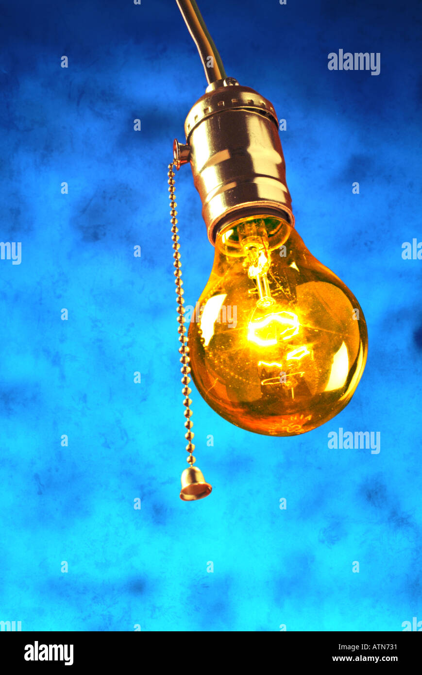 Bare clear light bulb in socket Stock Photo - Alamy