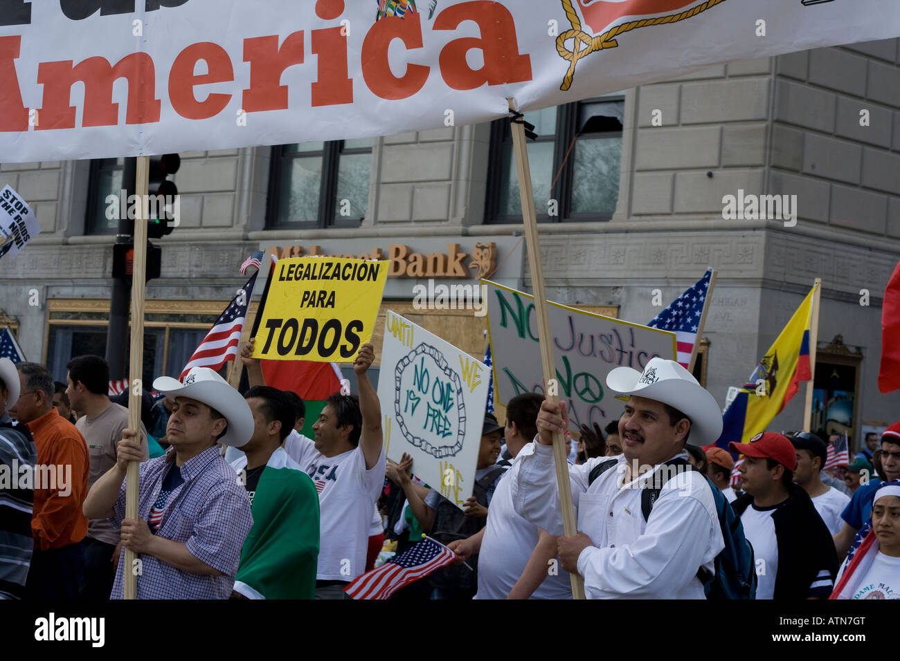 men carrying banners and signs that say legalization for all at the ...