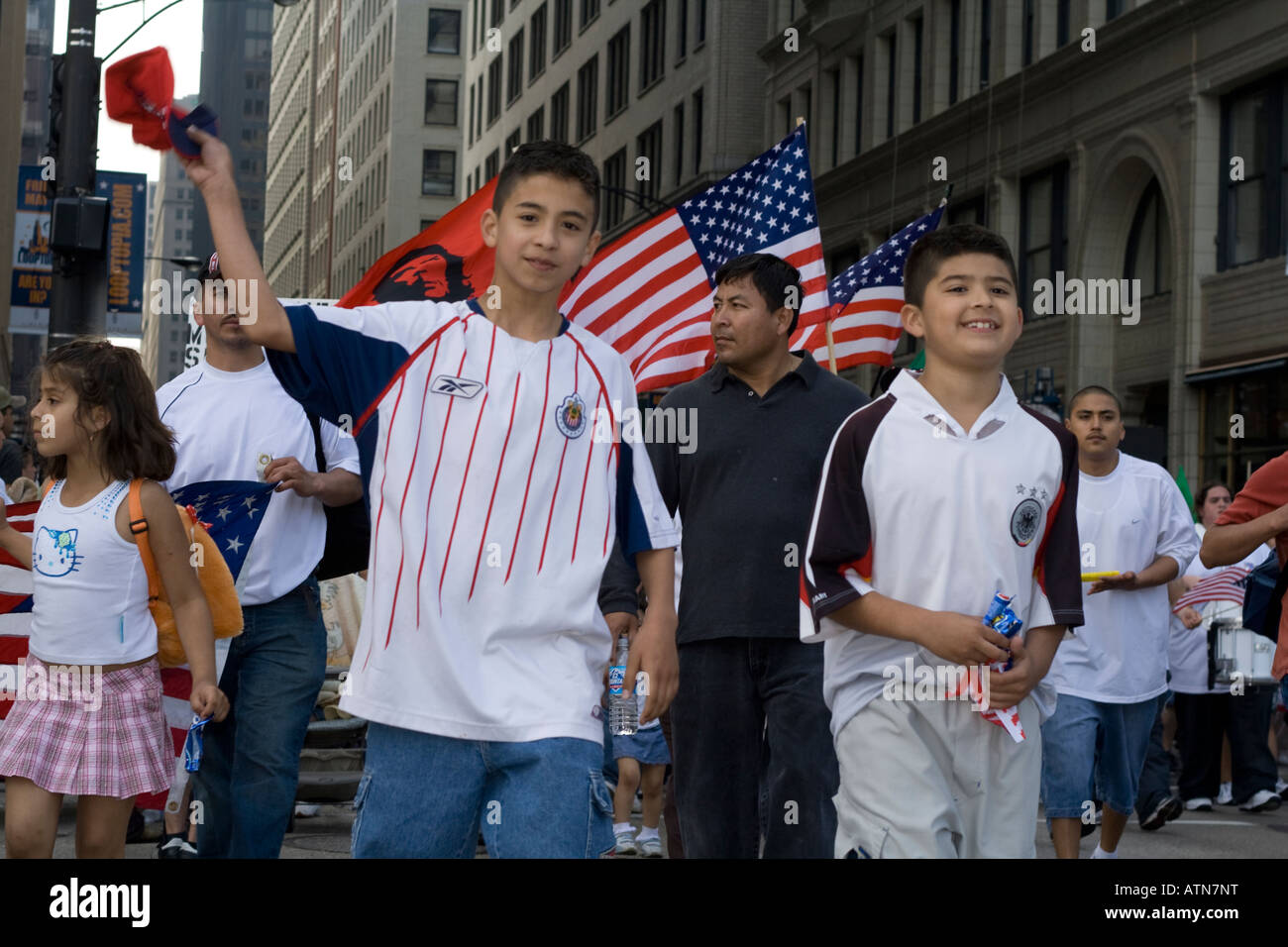 Chicago illinois immigration rally downtown kids waving Stock Photo - Alamy