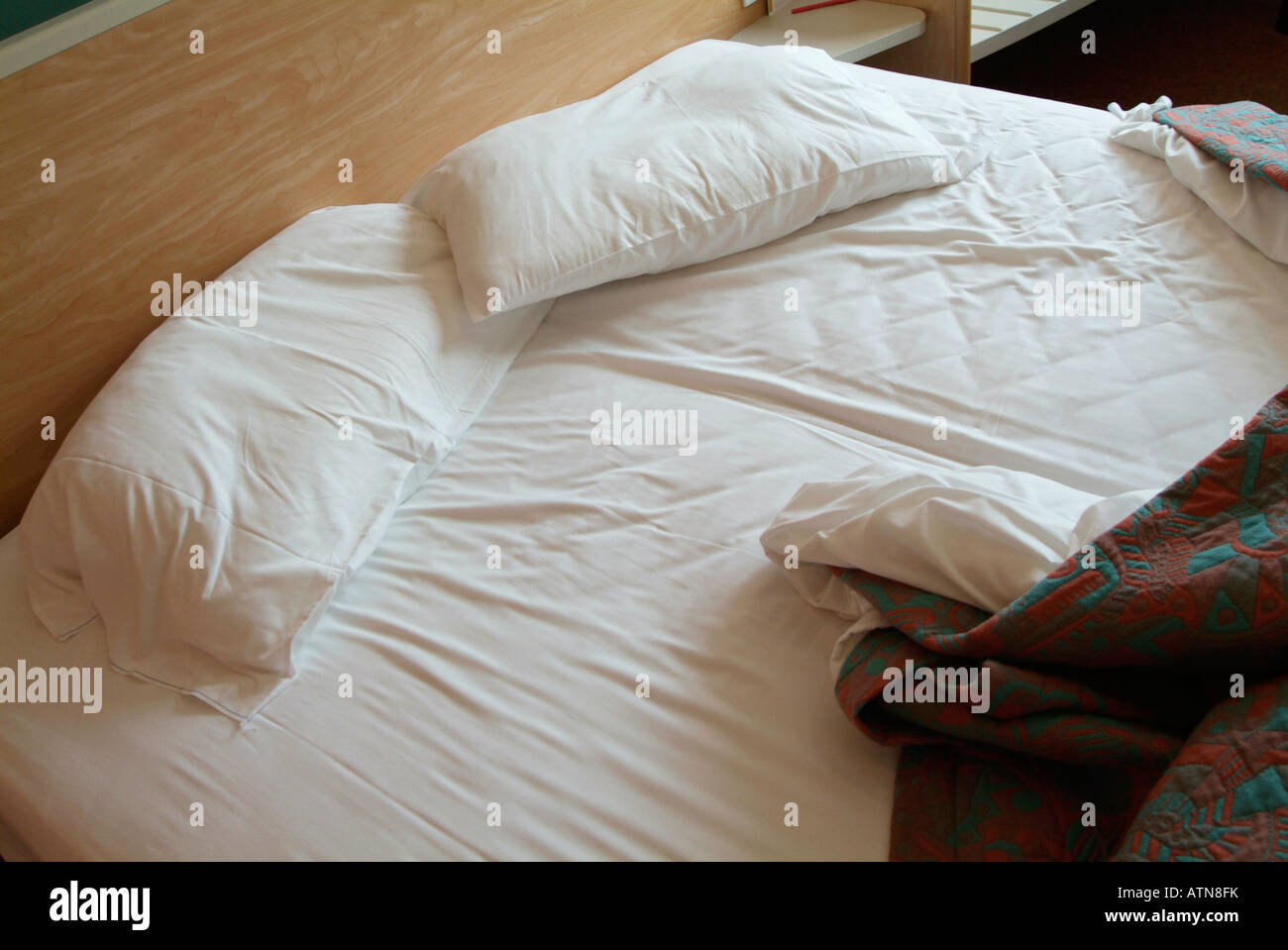 unmade bed in a hotel Stock Photo - Alamy