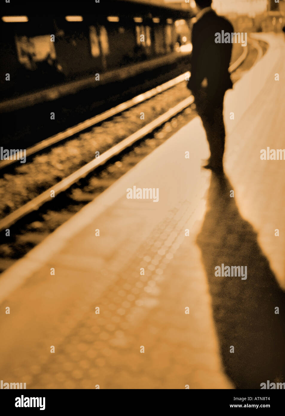 Man waiting for train Stock Photo - Alamy