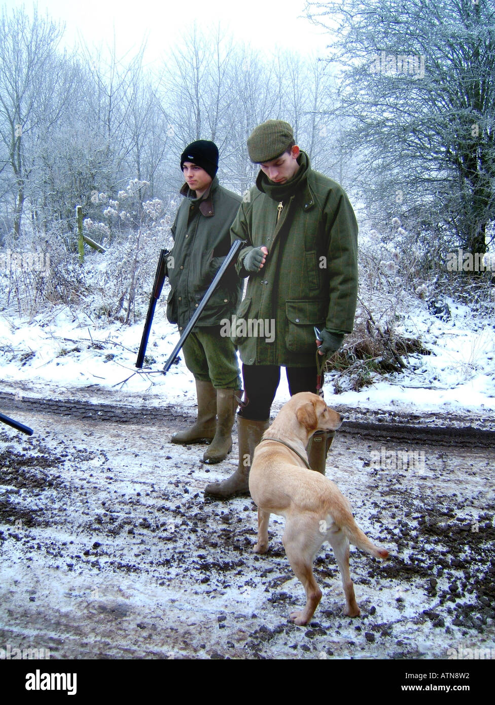 men shooting in the snow Stock Photo - Alamy