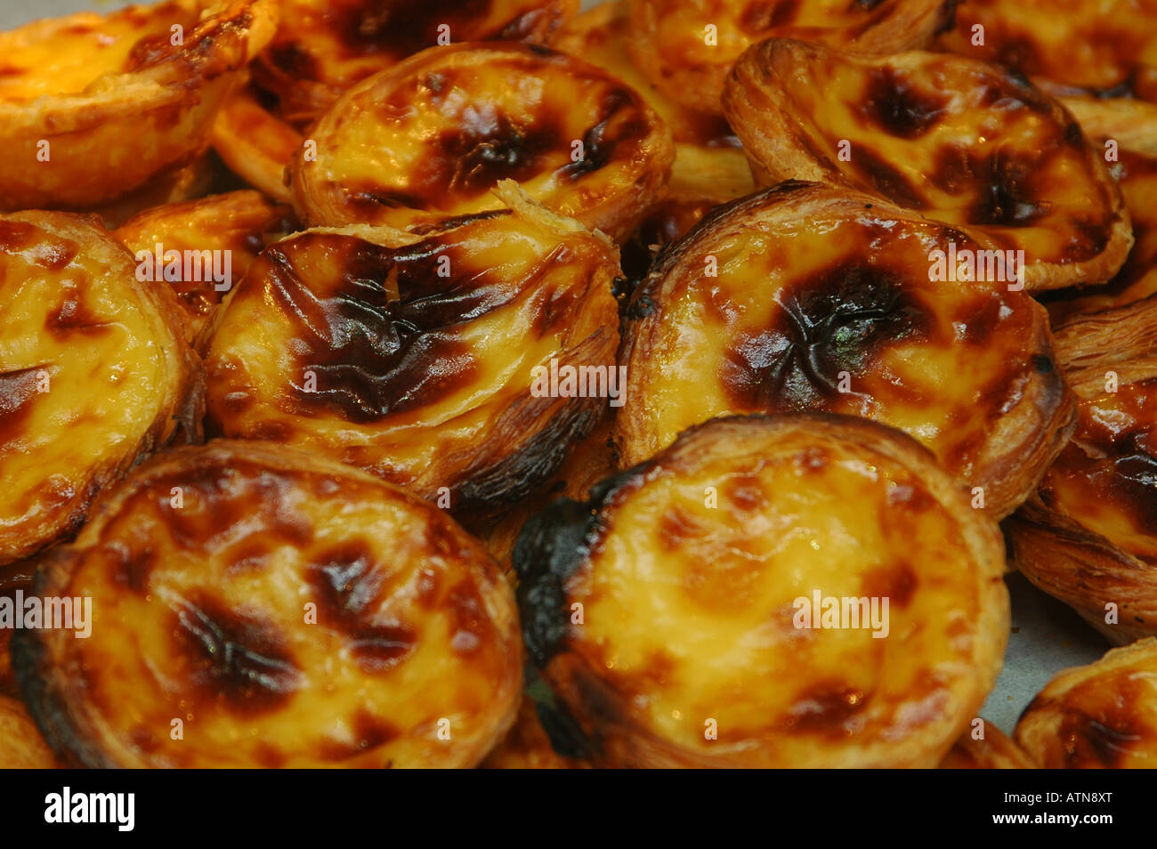 Stack of traditional Pastel Pasteis de nata a Portuguese egg tart ...