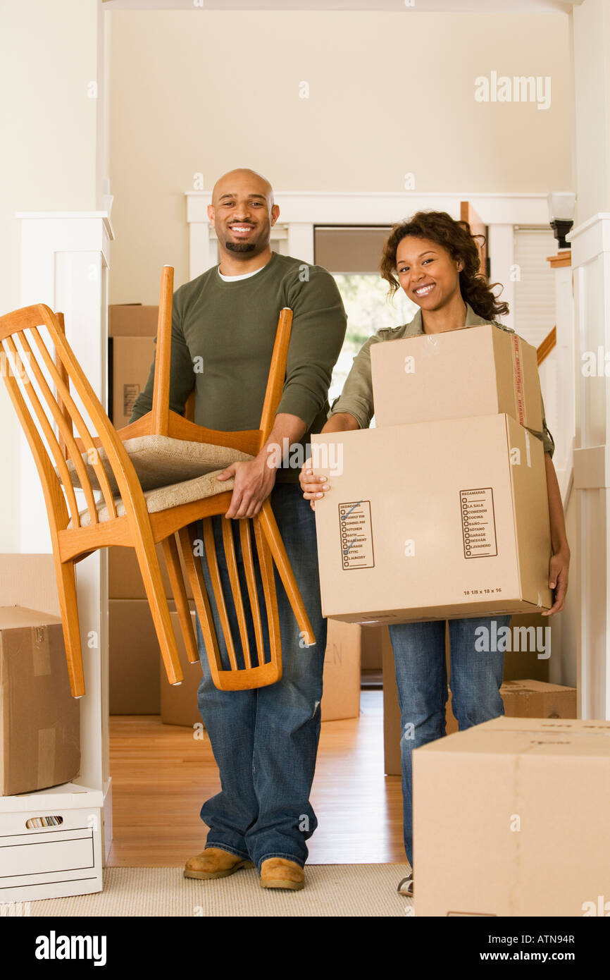 African couple moving boxes in new house Stock Photo - Alamy