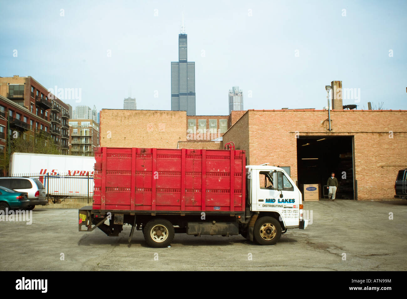 a red truck loading or unloading in Chicago Illinois with Sears tower ...