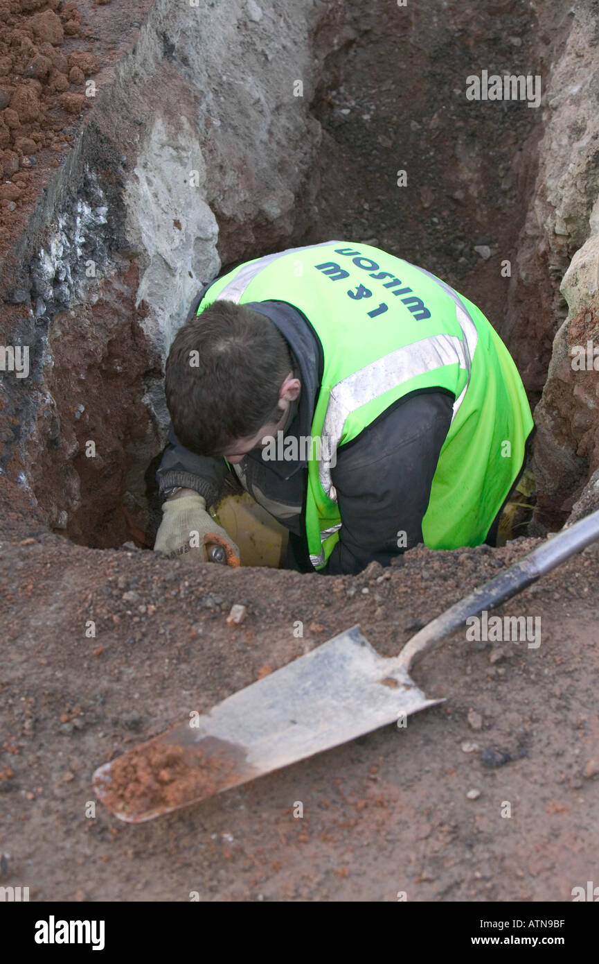 Man digging hole in road hi-res stock photography and images - Alamy