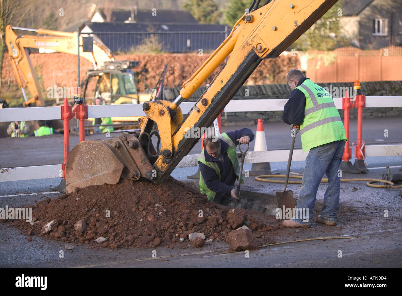 digging a hole in the road at roadworks Stock Photo - Alamy