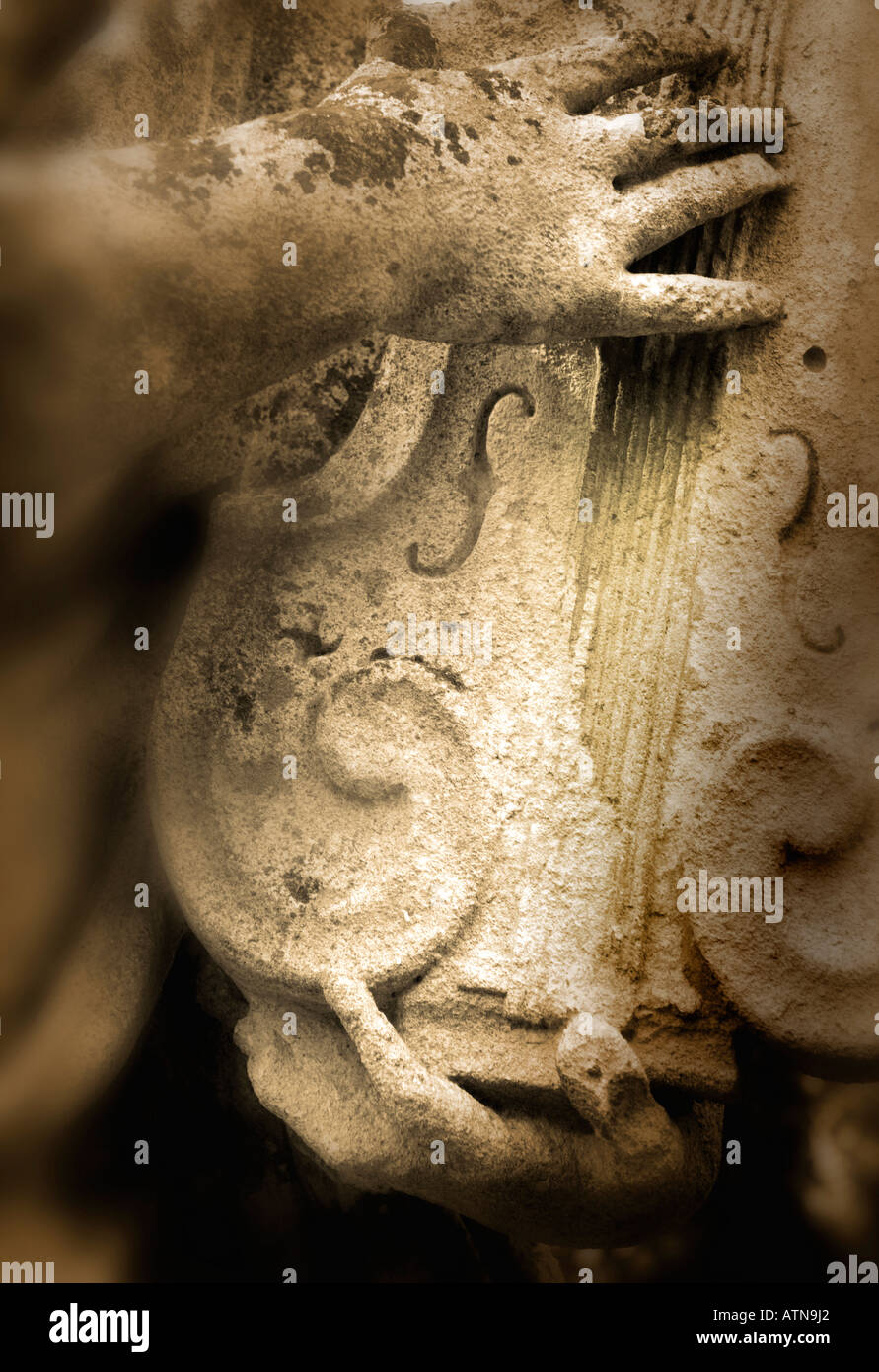 stone hand strumming stone lyre Stock Photo - Alamy