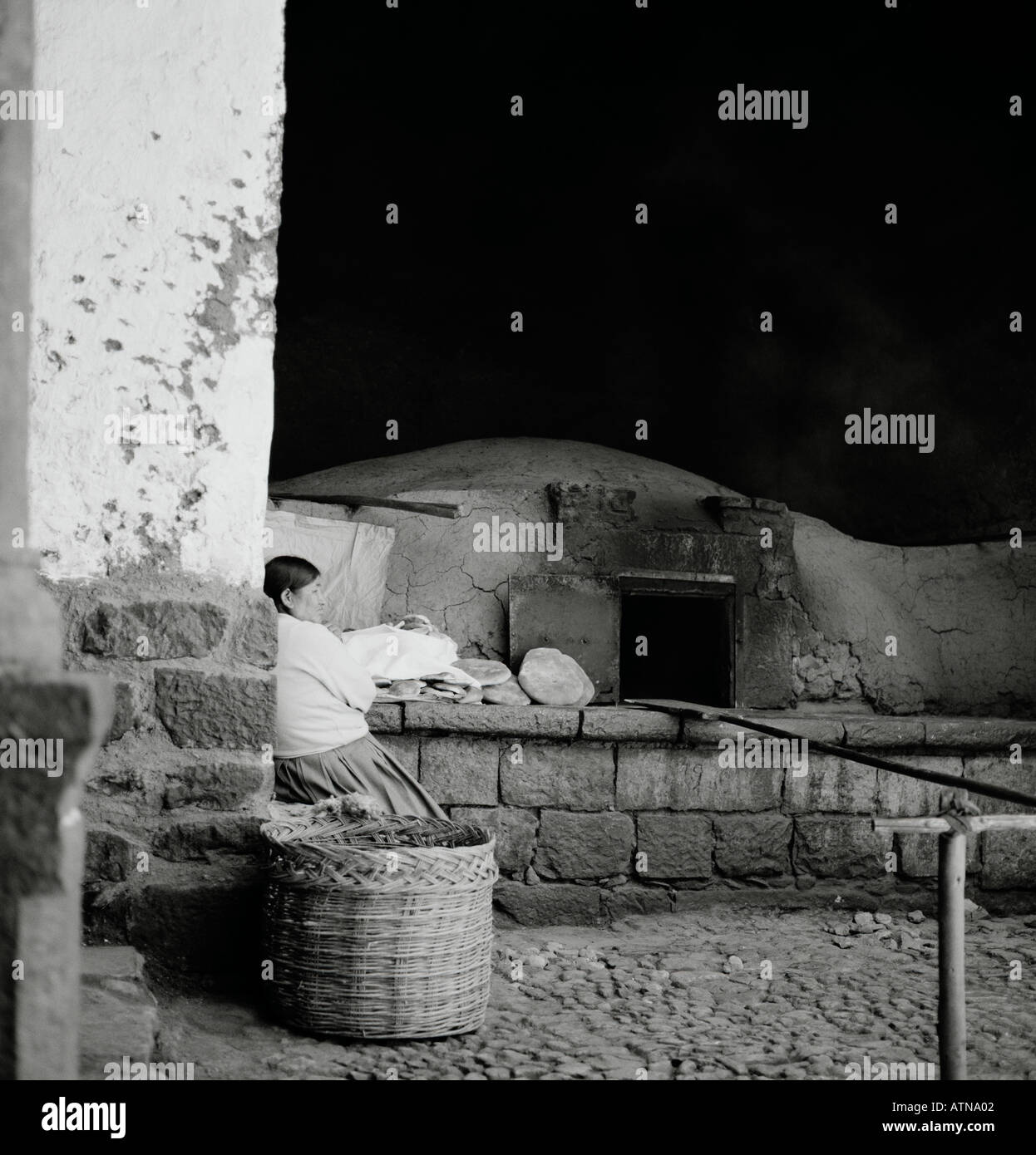Bread making in an ancient oven in Pisac in the Sacred Valley in the ...