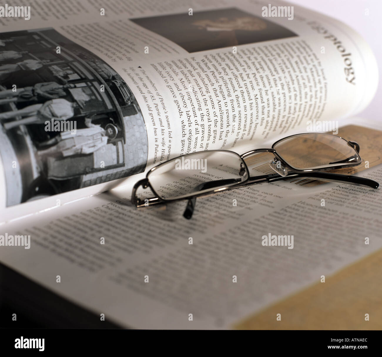 Open Book with Reading Glasses Stock Photo - Alamy