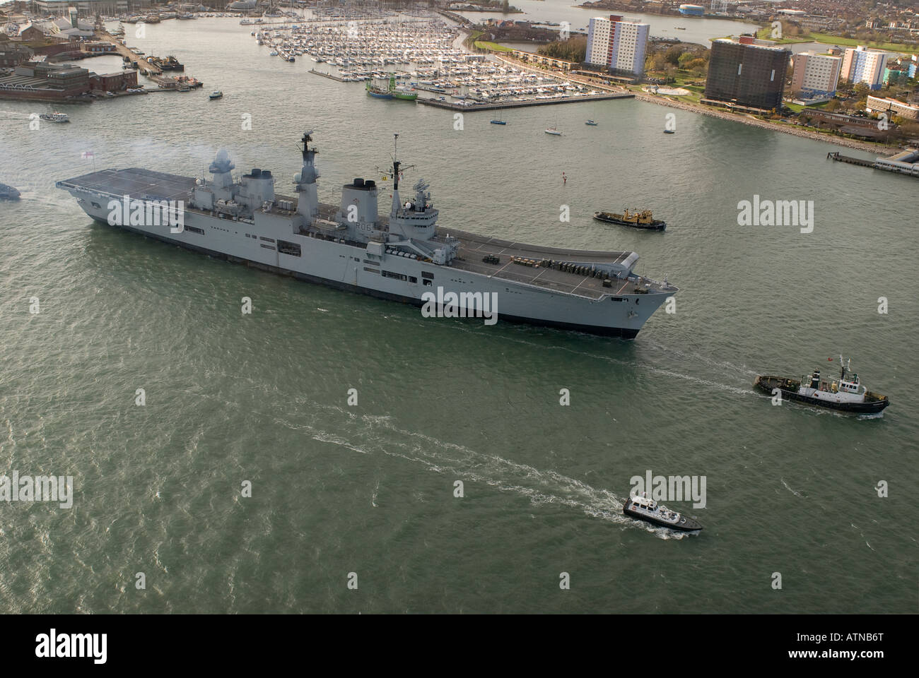 The Royal Navy HMS Illustrious entering Portsmouth harbour Stock Photo ...