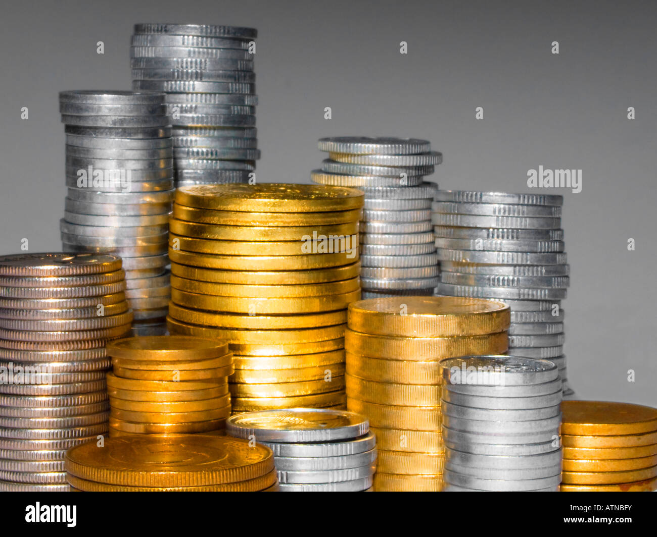 Piles of coins Stock Photo - Alamy