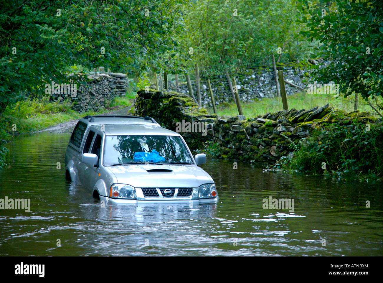A sight to gladden the heart: a 4x4 car stuck in a ford... River ...
