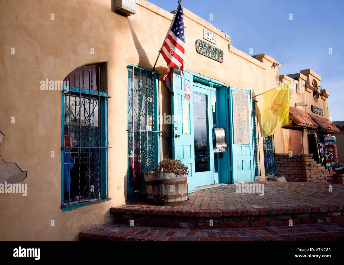 Flags of New Mexico and USA outside Store in Albuquerque Stock Photo ...