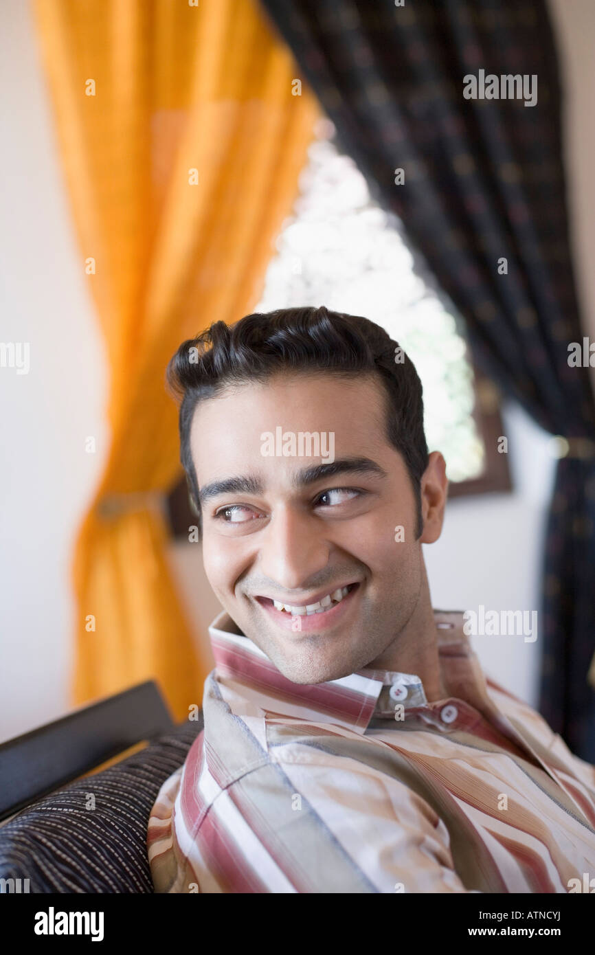 Side profile of a young man smiling Stock Photo - Alamy