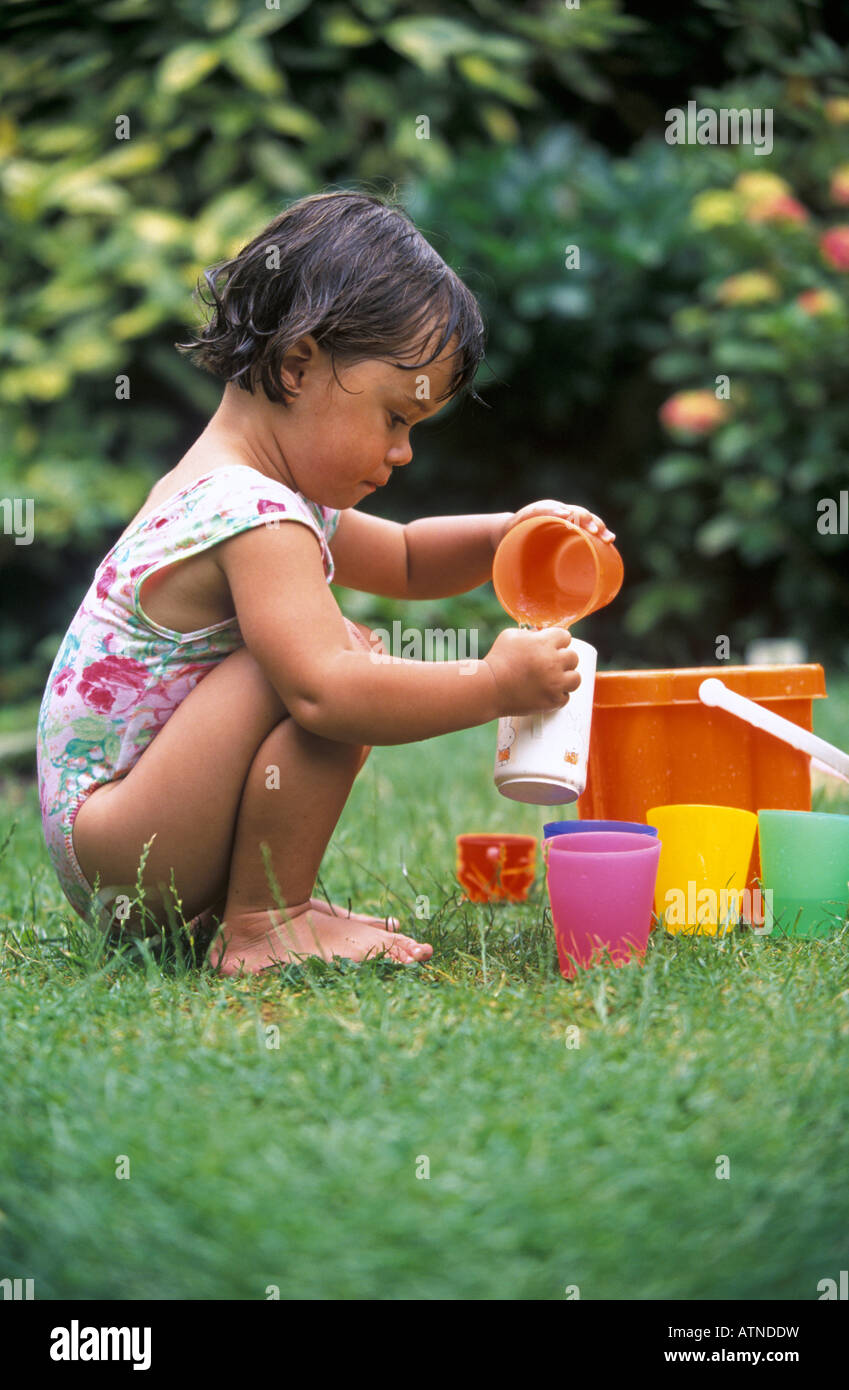 Toddler is playing with water Stock Photo - Alamy