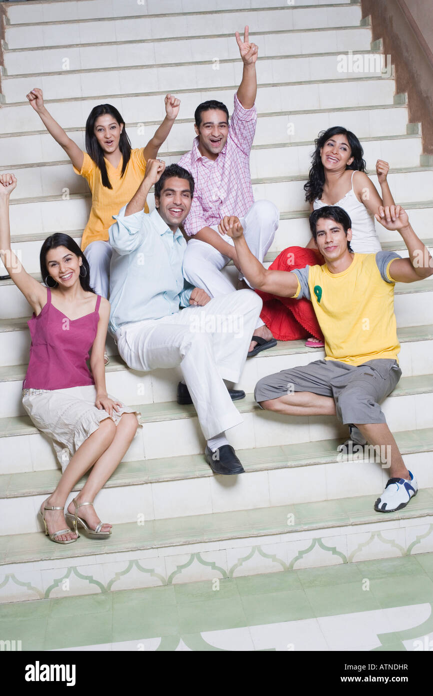 Portrait of three young couples sitting on steps and smiling Stock ...