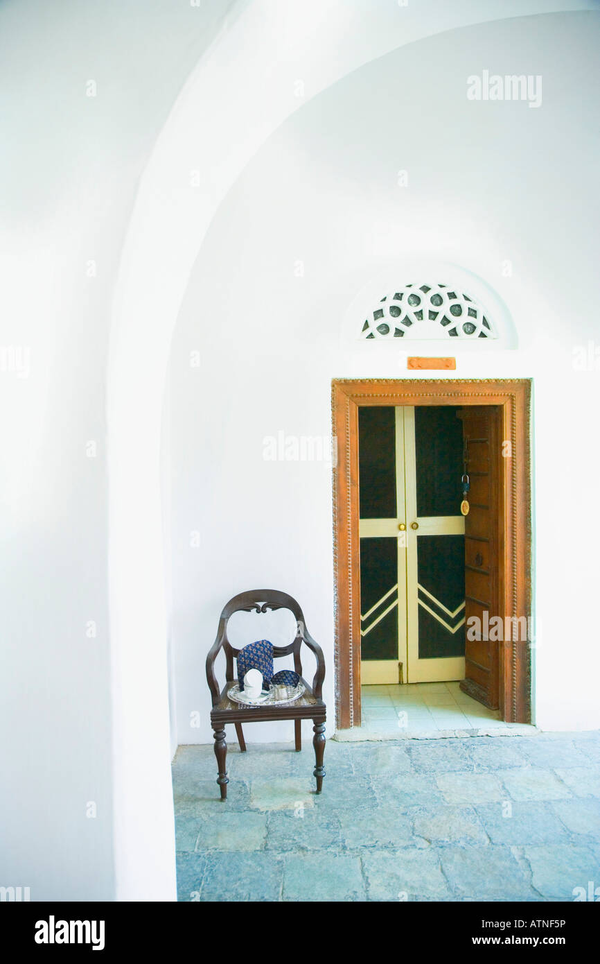Teapot in a tray on a chair Stock Photo - Alamy