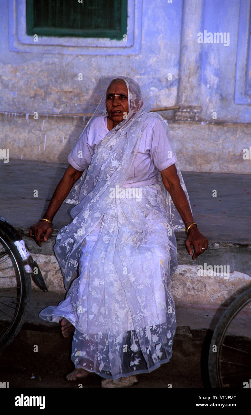 Widow watches parade in Pushkar Rajasthan India Stock Photo - Alamy