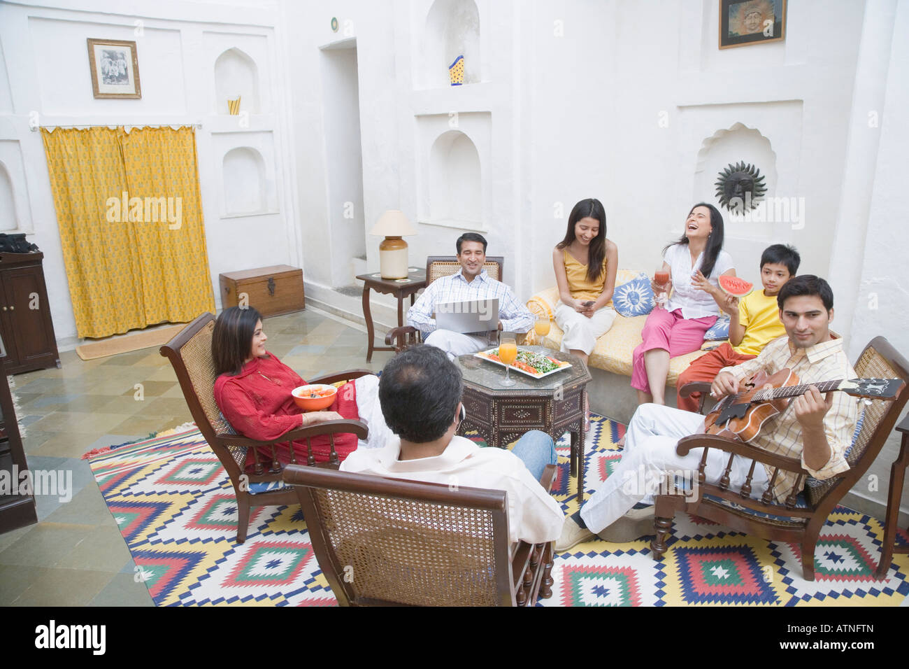 Group of people sitting together Stock Photo - Alamy