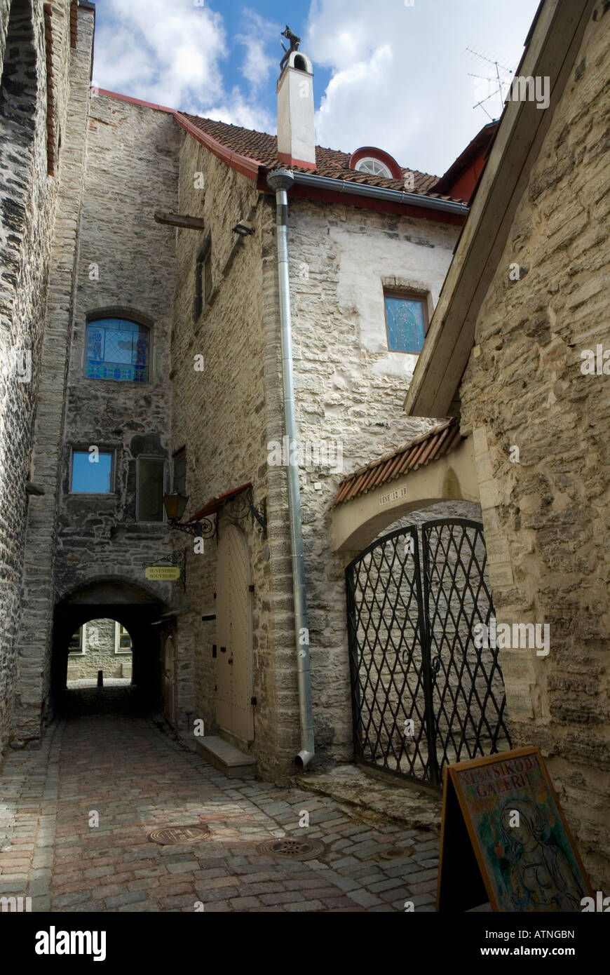 Inner street of Tallinn old town with gates Stock Photo - Alamy