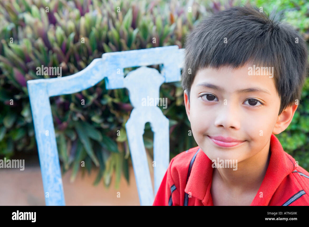Portrait of a boy smirking Stock Photo - Alamy