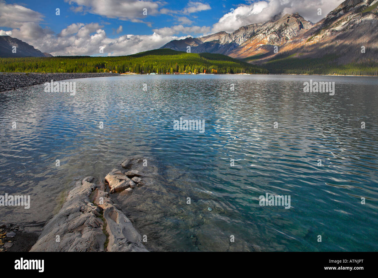A lake bank and a stone acting from water Stock Photo - Alamy
