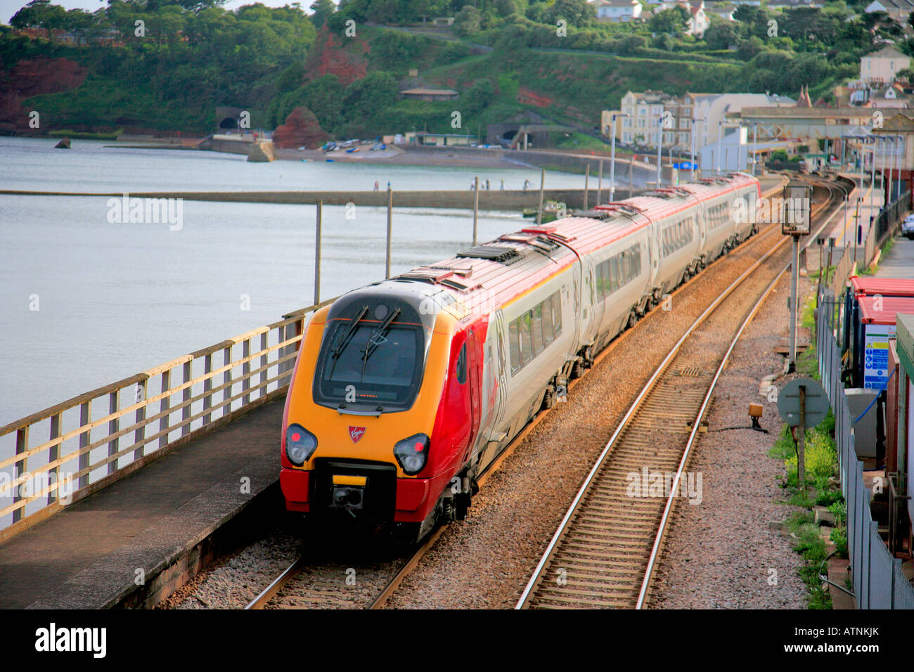 Virgin Voyager 221 128 diesel train on its way into Dawlish station ...