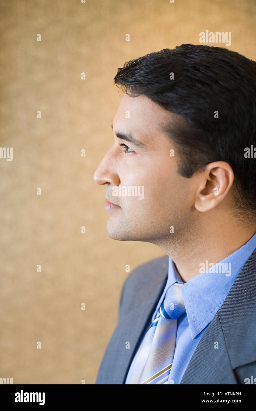Side profile of a businessman looking away Stock Photo - Alamy