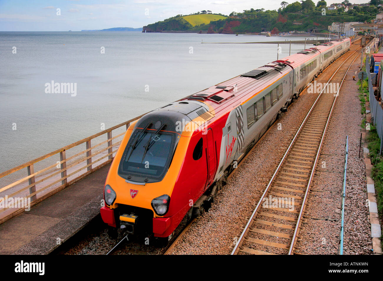 Virgin Voyager 221 128 diesel train on its way into Dawlish station ...