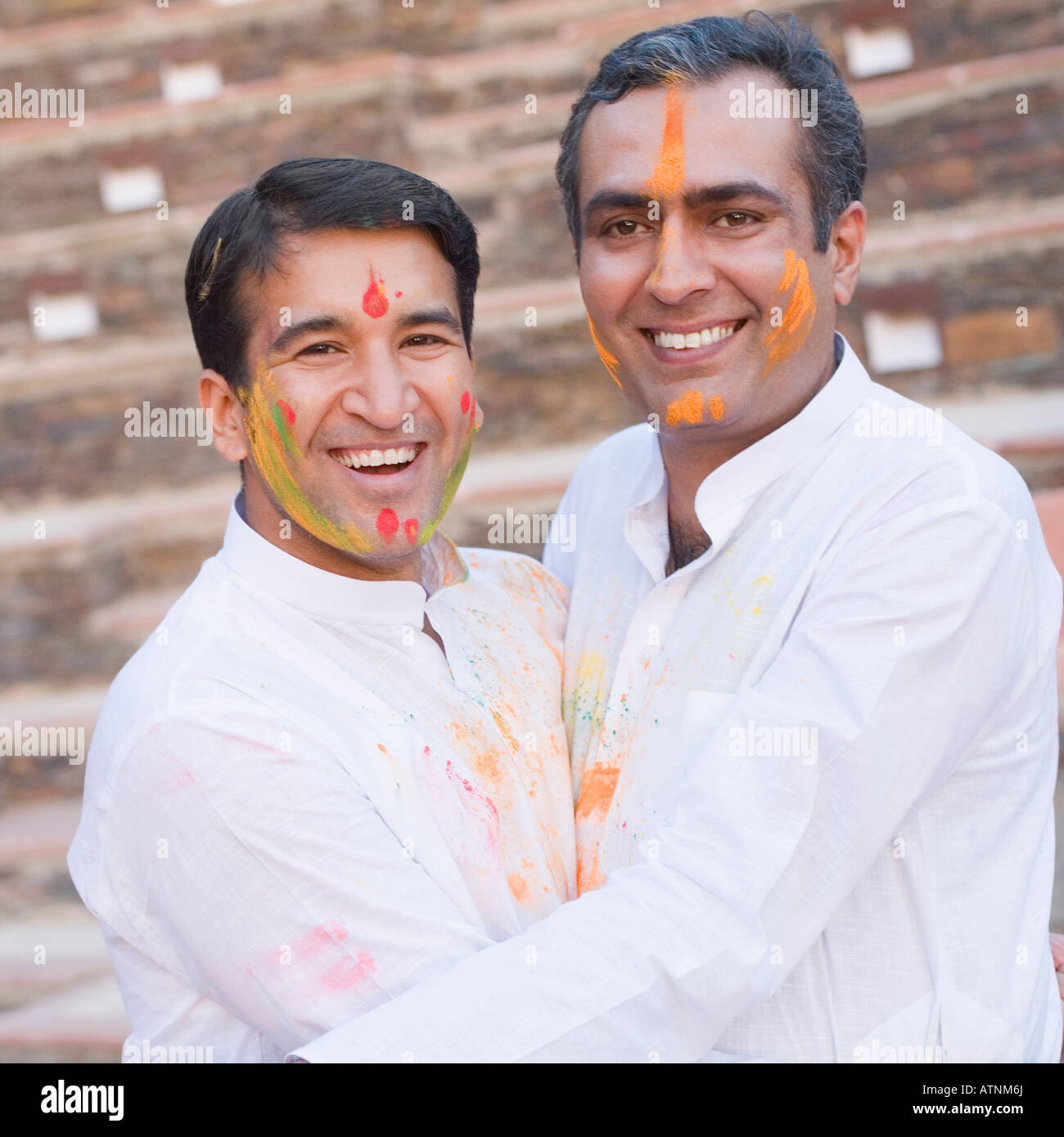 Portrait of two mid adult men hugging each other Stock Photo - Alamy