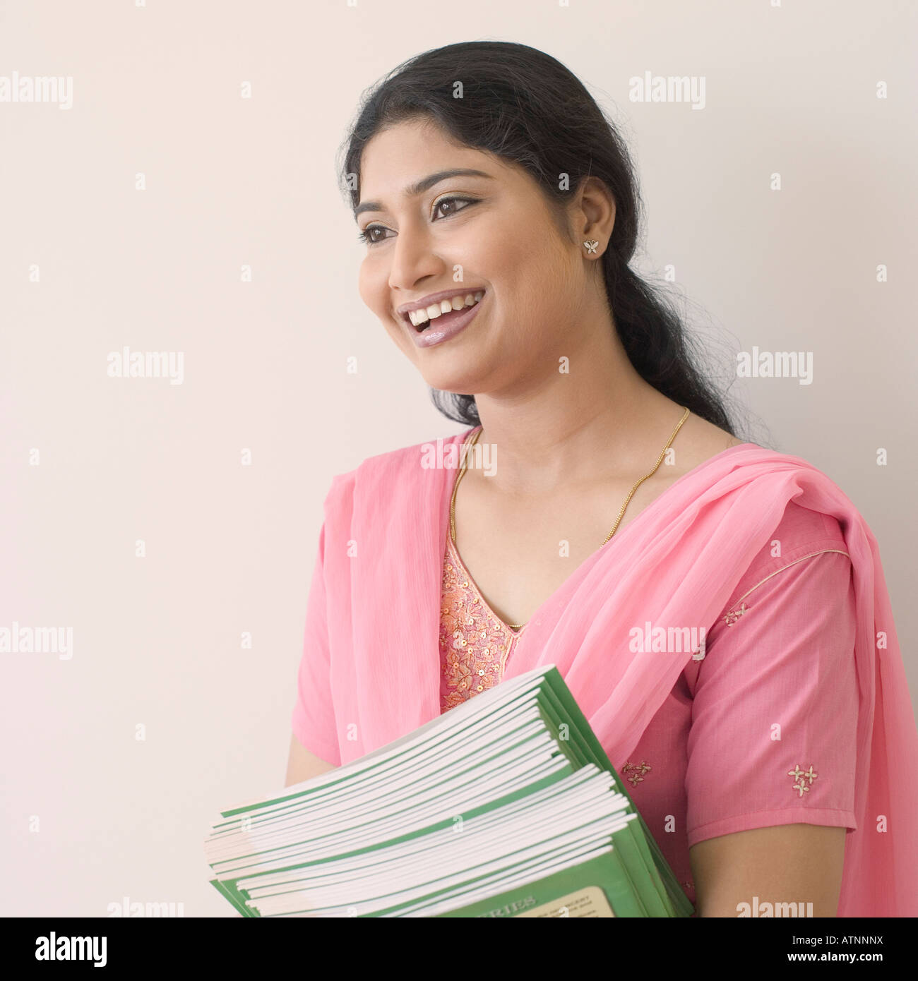 A Teacher Holding Books High Resolution Stock Photography and Images ...