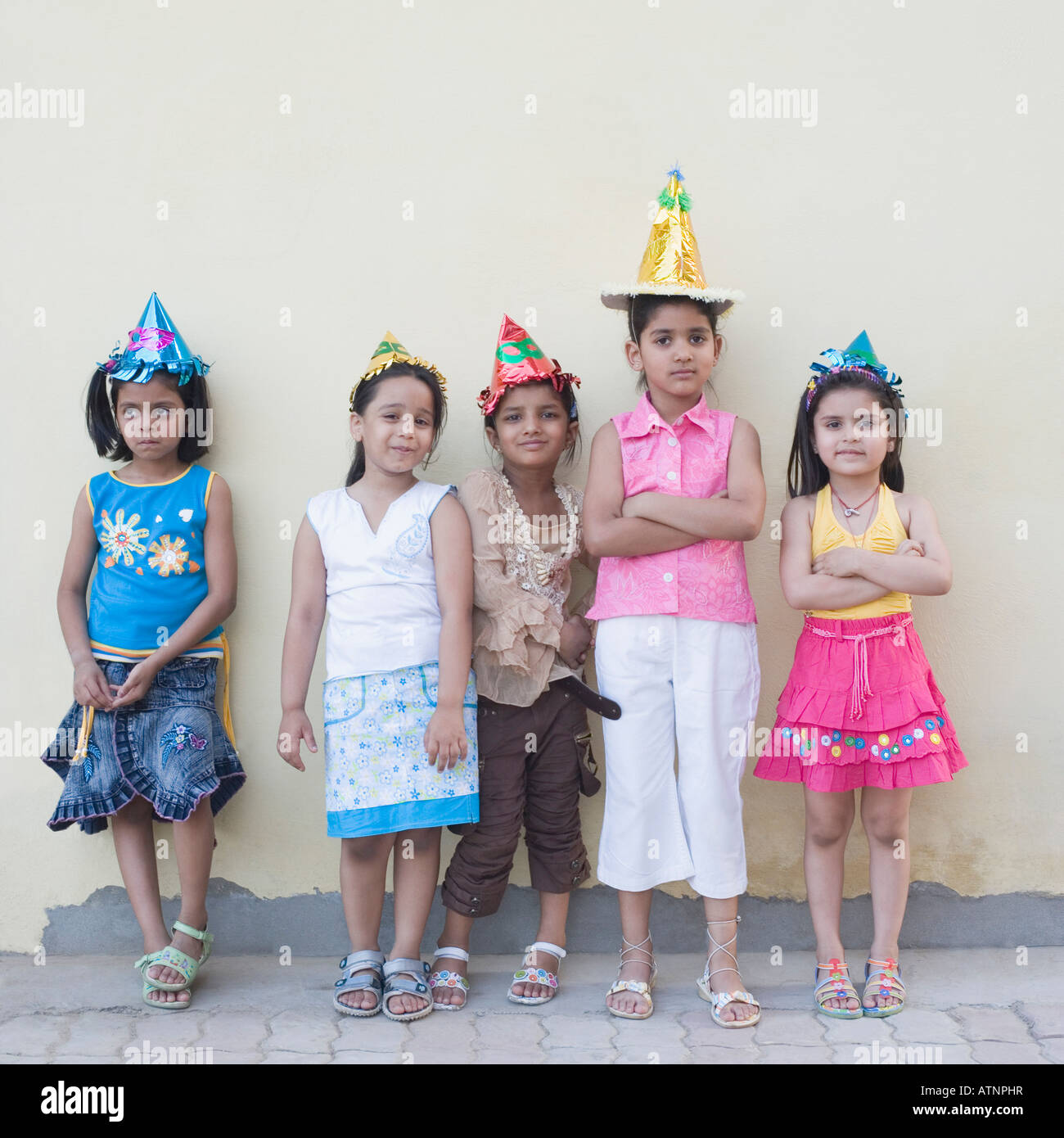 Five girls wearing party hats and standing together Stock Photo - Alamy