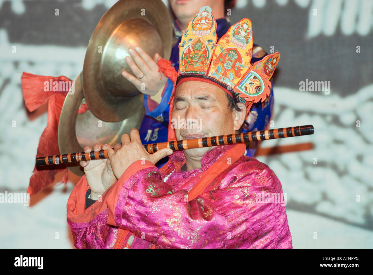 China, Chinese Man Playing A Bamboo Flute, Lijiang, Yunnan Province ...